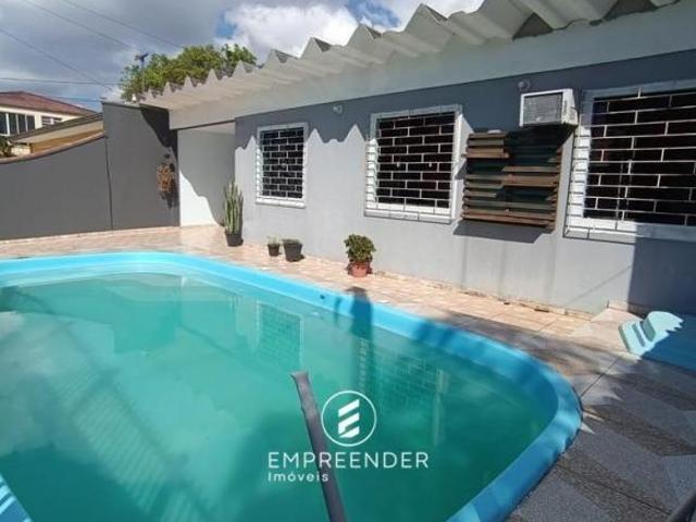 Casa a venda com piscina Balneario Ipanema