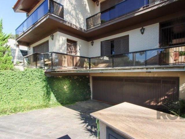Casa a venda com 03 dormitórios, living 03 ambientes com vista para o Rio
