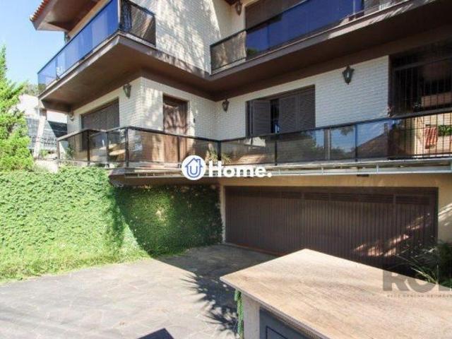 Casa a venda com 03 dormitórios, living 03 ambientes com vista para o Rio