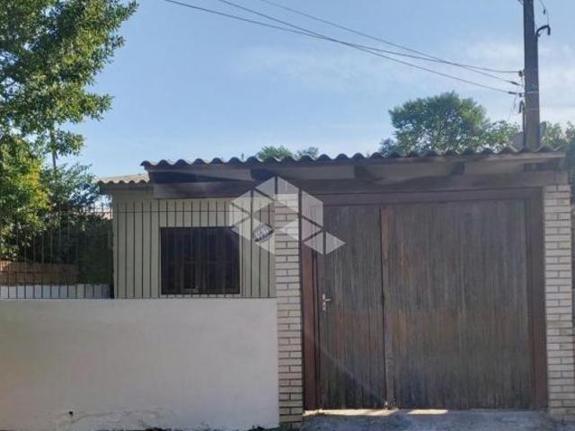 Casa à venda com 2 quartos, suíte, 2 vagas garagem em terreno com 2 casas