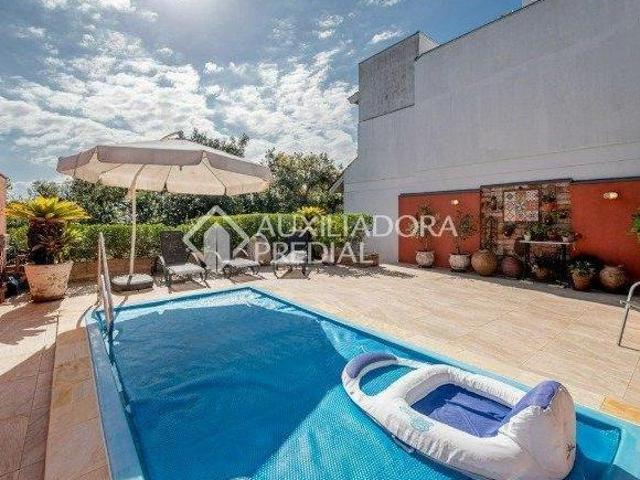Casa à venda com 3 dormitórios, 3 suítes, 376,13m² e 4 vagas no bairro Sétimo Céu