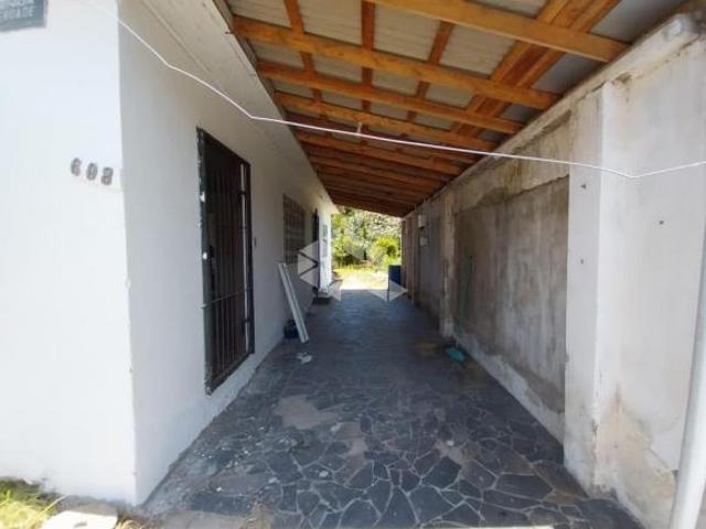 Casa à venda com 3 dormitórios, 2 vagas, energia solar, na Alegria em Guaíba