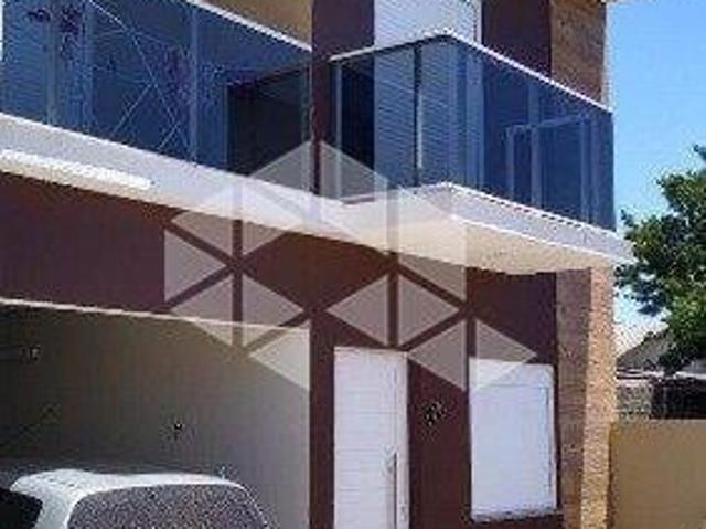Casa à venda com 3 quartos e suíte no bairro Parque Pinheiro Machado em Santa Maria RS
