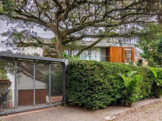 Casa à venda com 4 dormitórios, 463,70m² e vista panorâmica para o Guaíba no bairro Vila Conceição