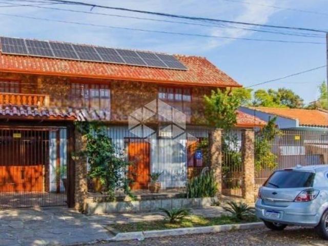 Casa a venda com 4 dormitórios, sendo 1 suíte, com piscina bairro Harmonia
