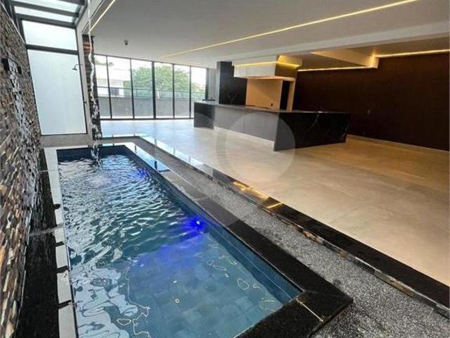 Casa à venda com 4 suítes no condomínio Parque Faber IV, São Carlos