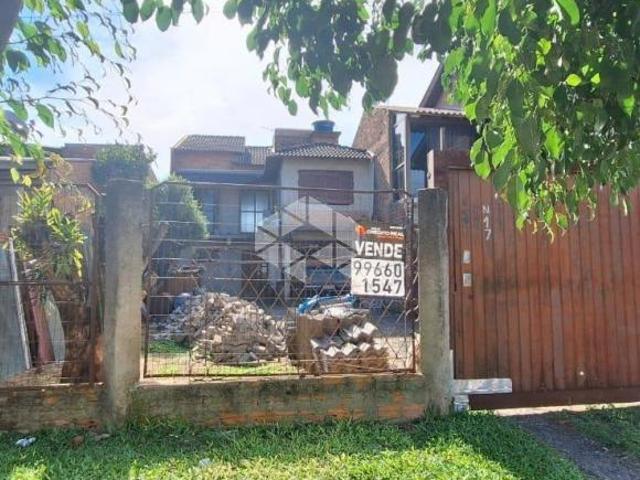 Casa à venda de 216m² no bairro Estância Velha, Canoas, com 3 quartos 2 suítes