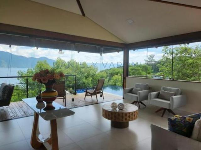 CASA À VENDA EM CONDOMÍNIO  4 SUÍTES  VISTA PARA O MAR  PISCINA DE BORDA INFINITA EM ILHABELA SP
