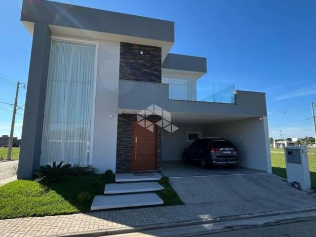Casa à venda em condomínio fechado em Eldorado do Sul com 3 dormitórios e 2 vagas