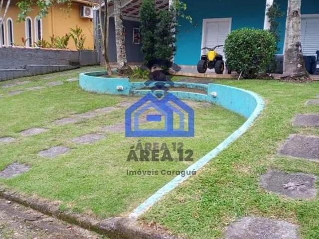 Casa à venda em Condomínio no bairro do Massaguaçu 3 dormitórios, sendo 1 suíte, 4 banheiros, sala