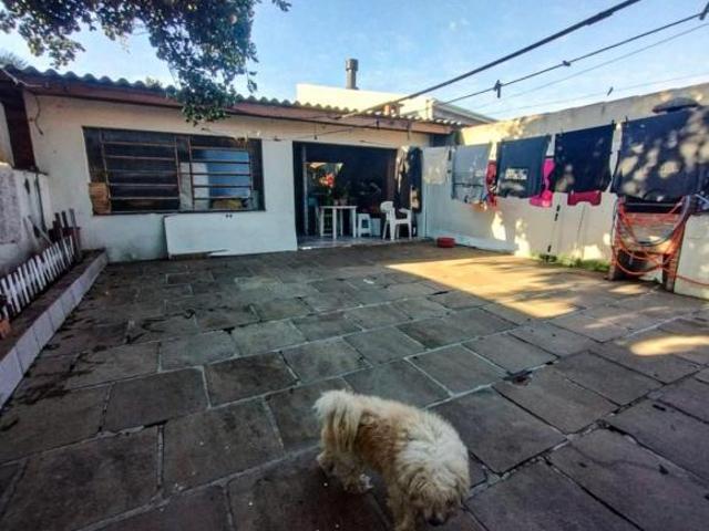 Casa à venda em Canoas, Nossa Senhora das Graças, com churrasqueira e ar condicionado