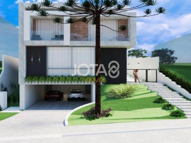 CASA EM CONDOMÍNIO COM 4 SUÍTES E 4 VAGAS DE GARAGEM