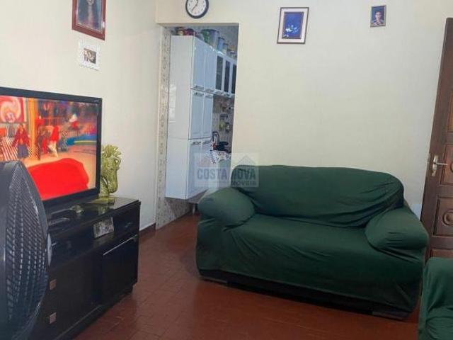 Casa à venda em São Vicente com 2 dormitórios, quintal e espaço gourmet ? 66m²