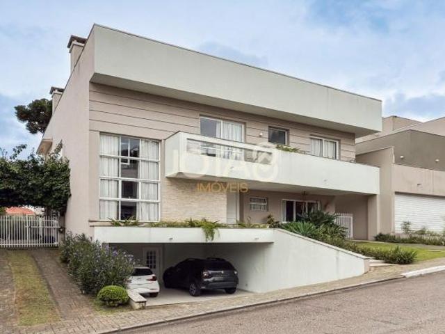 CASA EM CONDOMÍNIO COM 5 SUÍTES, SENDO 1 TÉRREA EM SANTA FELICIDADE