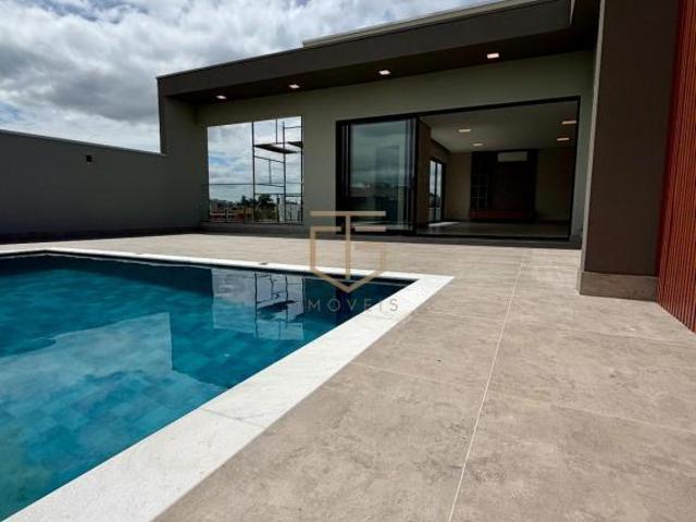 Casa à venda em Paulínia, Parque Brasil 500, com 3 suítes, com 271.22 m², Santorini Residencial Club