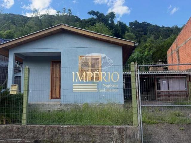 Casa à venda em Três Coroas RS, bairro Loteamento do Raul: 2 quartos, sala, banheiro, 1 vaga, 90m²