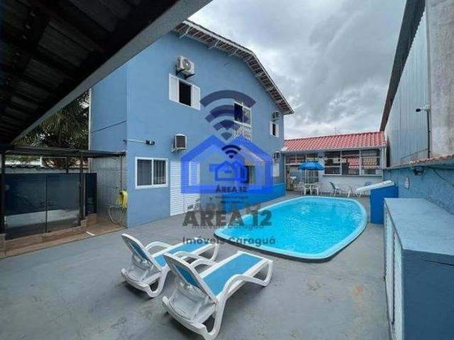 Casa à Venda no bairro Praia das Palmeiras com 3 dormitórios, sendo 1 suíte, banheiro e sala Carag