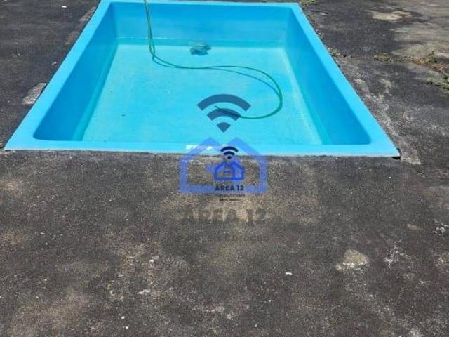 Casa ampla com quintal espaçoso à venda no bairro Pontal de Santa Marina em Caraguatatuba, SP