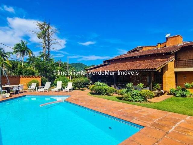 Casa assobradada à venda no Jardim Acapulco em Guarujá