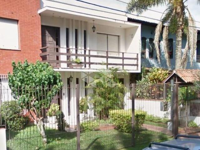 CASA BAIRRO IPANEMA COM 3 DORMITÓRIOS, 4 BANHEIROS, 2 VAGAS DE GARAGEM