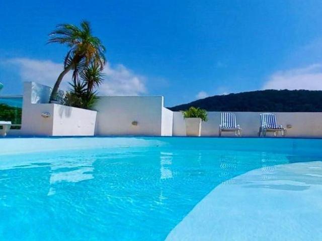 Casa beira mar à venda no Guaiúba no Guarujá, SP | QVista Inteligência Imobil.