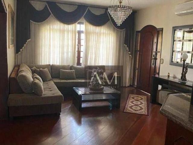 Casa com 4 dormitórios à venda, 348 m² por R$ 1.700.000