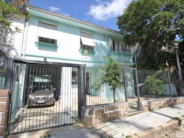 Casa com 4 dormitórios à venda, 350 m² por R$ 1.098.000,00 Auxiliadora Porto Alegre/RS