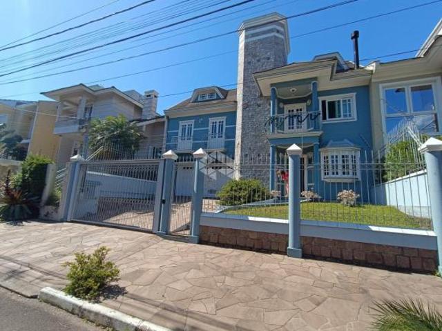 Casa com 4 dormitórios à venda no Moinhos de Vento bairro Marechal Rondon, Canoas