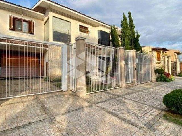 Casa com 4 dormitórios, 1 suíte, 4 vagas no Bairro Moinhos em Canoas