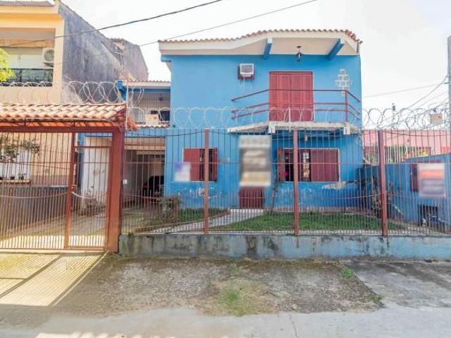 Casa com 4 quartos, 1 suíte, vaga de garagem e churrasqueira à venda em Sarandi