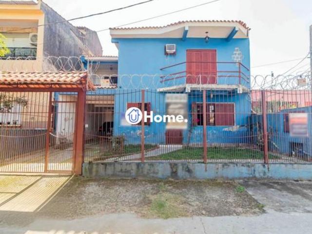 Casa com 4 quartos, 1 suíte, vaga de garagem e churrasqueira à venda em Sarandi
