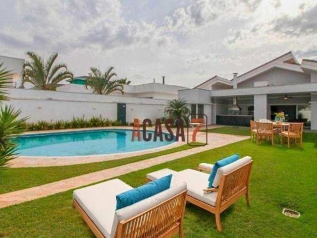 Casa à venda e locação, com 452m², 4 suites e 4 vagas de garagem Condomínio Evidence Residencial