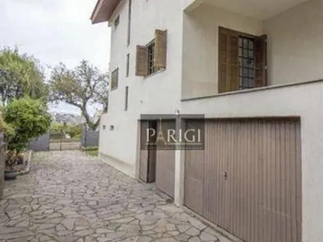 Casa com 5 dormitórios para alugar, 369 m² por R$ 5.300,00/mês Santa Tereza Porto Alegre/RS