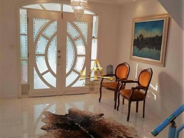 Casa com 5 dormitórios à venda, 520 m² por R$ 4.180.000,00 Alphaville Residencial 5 Santana de P