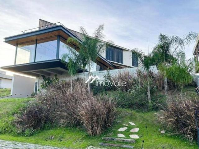 Casa com 5 dormitórios à venda, 819 m² por R$ 7.500.000,00 Condomínio Reserva do Paratehy São Jo