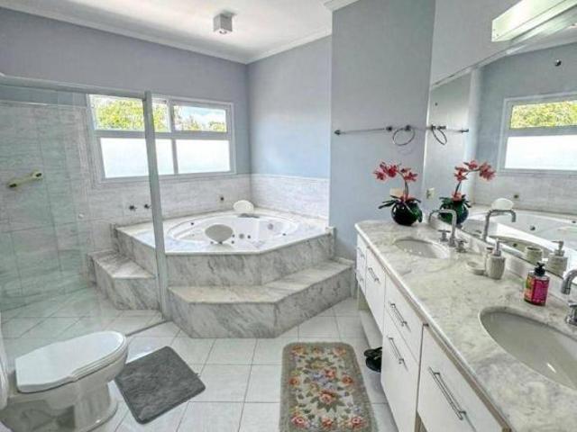 Casa com 6 dormitórios à venda, 589 m² por R$ 4.950.000,00 Condomínio Jardim das Palmeiras Braga