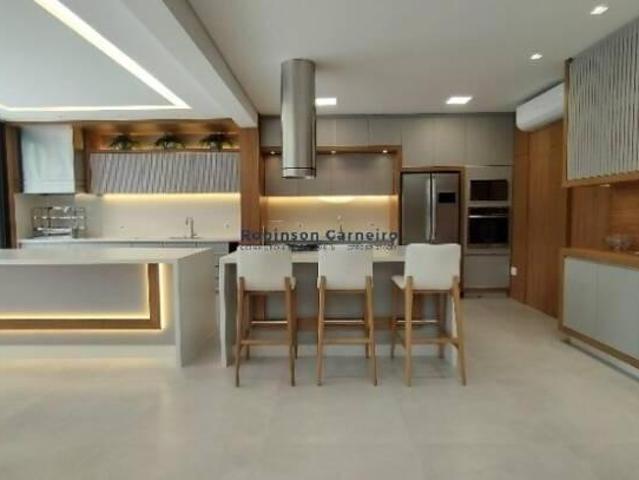 Casa com 6 suítes, 425m2 de área construída à venda na Riviera