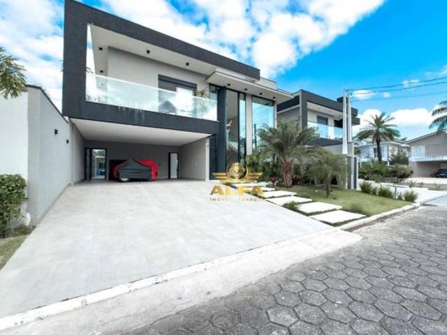 Casa com 6 suítes, área gourmet integrada e energia fotovoltaica no Jardim Acapulco – Alfa Imóveis G