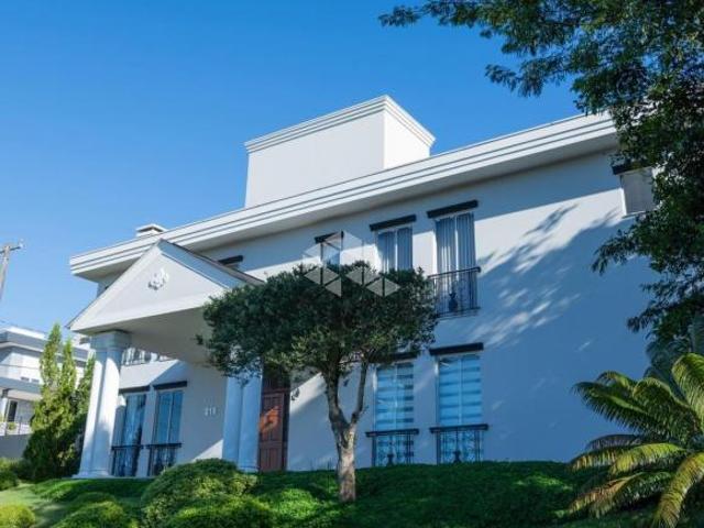 Casa com 04 suítes, piscina aquecida e alto padrão no Condomínio Serra Azul!