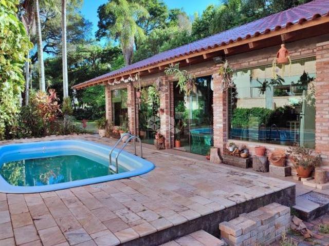 Casa com 292 m² e 4 quartos à venda no bairro Tristeza