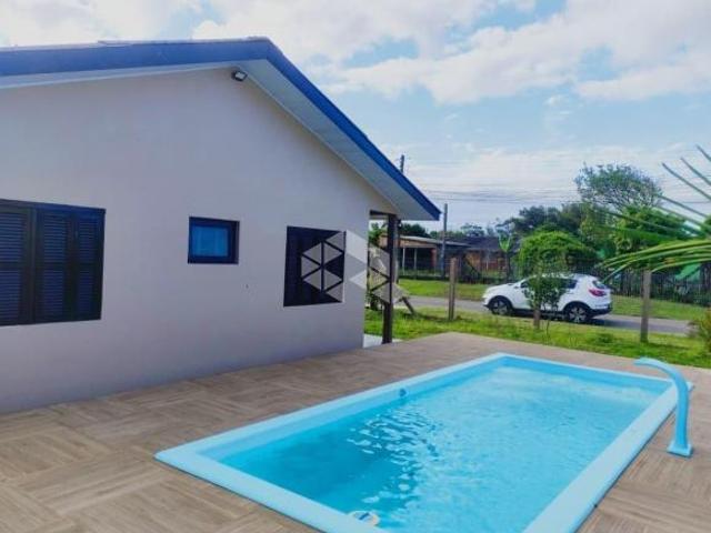 Casa com 2 dormitórios mobiliada com garagem fechada em Arroio Teixeira