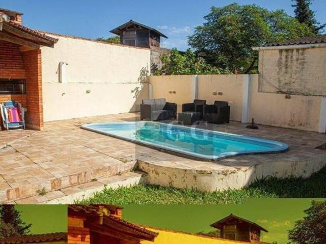 Casa com 2 dormitórios à venda, 186 m² por R$ 559.900,00 Sitio São José Viamão/RS