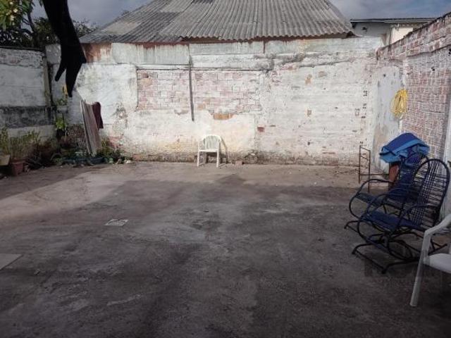 Casa com 2 dormitórios, vaga, amplo pátio, no bairro Santa Rosa de Lima, Poa/RS