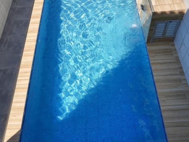 Casa com 2 quartos, Mirim com Edícula, Praia Grande R$ 650 mil