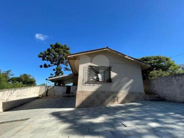 CASA COM 2.100 m² DE TERRENO EM SANTA FELICIDADE NATUREZA PRIVACIDADE POTENCIAL CONSTRUTIVO