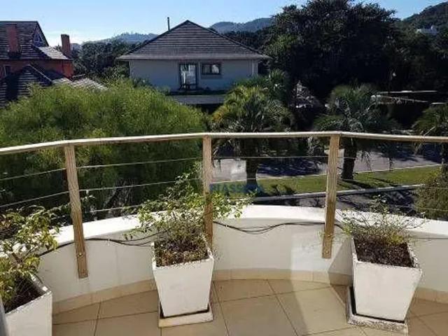Casa com 3 dormitórios à venda, condomínio fechado, 368 m² por R$ 6.790.000 Jurerê Florianópolis