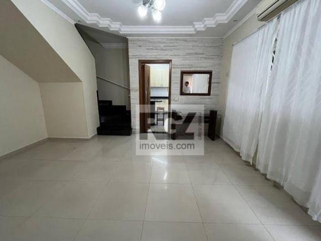 Casa com 3 dormitórios à venda, 108 m² por R$ 1.700.000,00 Aparecida Santos/SP