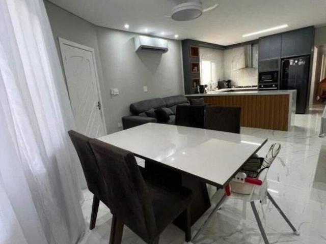 Casa com 3 dormitórios à venda, 100 m² por R$ 550.000,00 Tude Bastos Praia Grande/SP