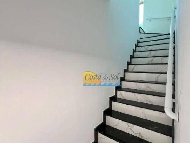 Casa com 3 dormitórios à venda, 119 m² por R$ 600.000,00 Tude Bastos Praia Grande/SP