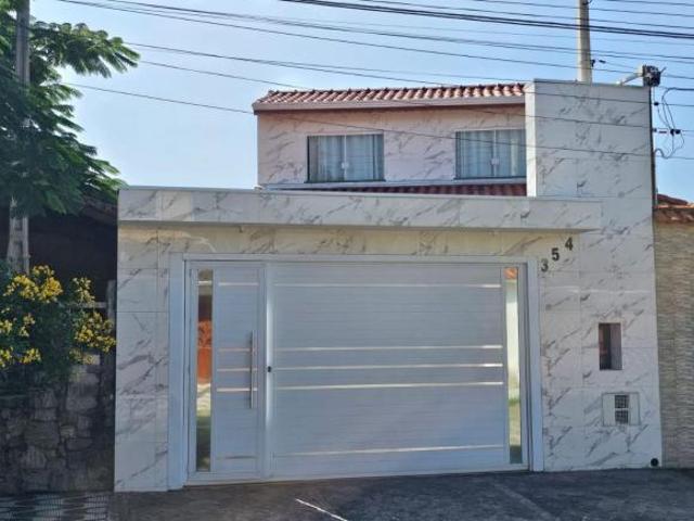 Casa com 3 dormitórios à venda, 120 m² por R$ 775.000,00 Solemar Praia Grande/SP